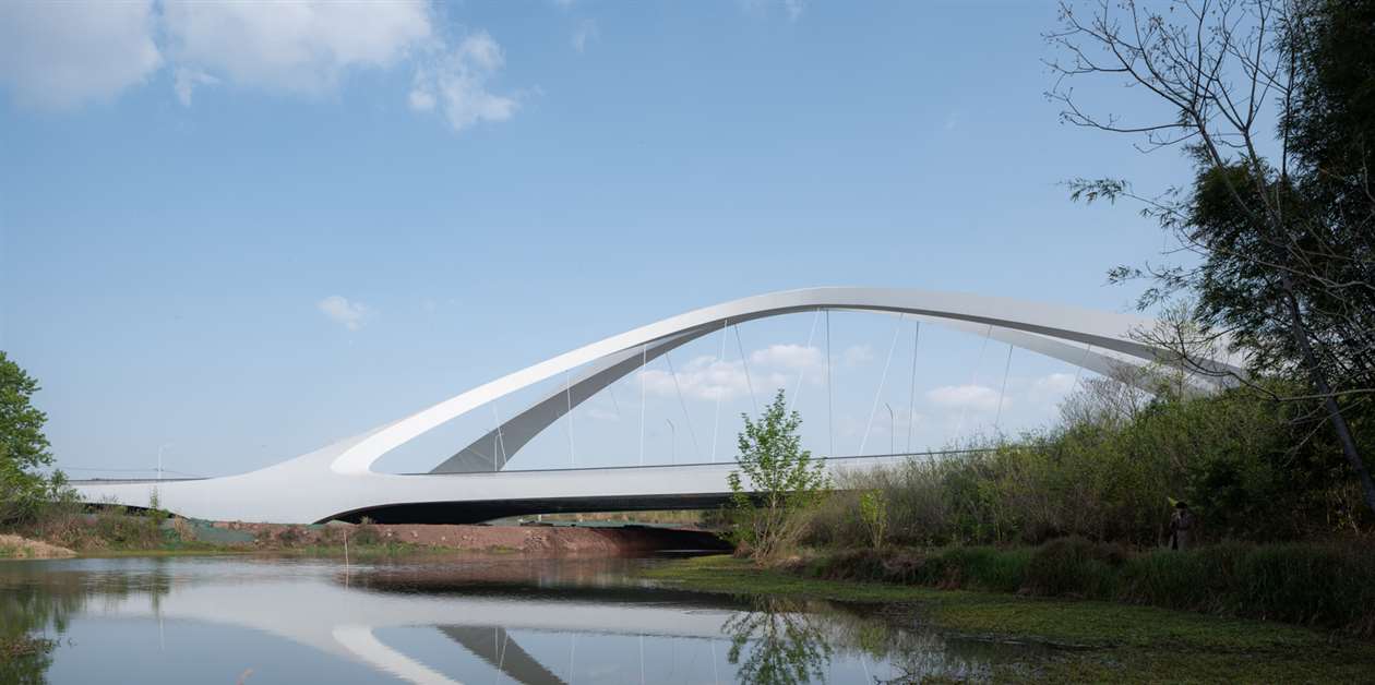 Zaha Hadid Architects unveils the first in a series of bridges in China ...