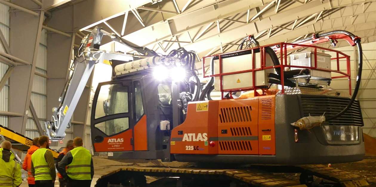 Armoured excavator deployed for remediation works at World War II army ...